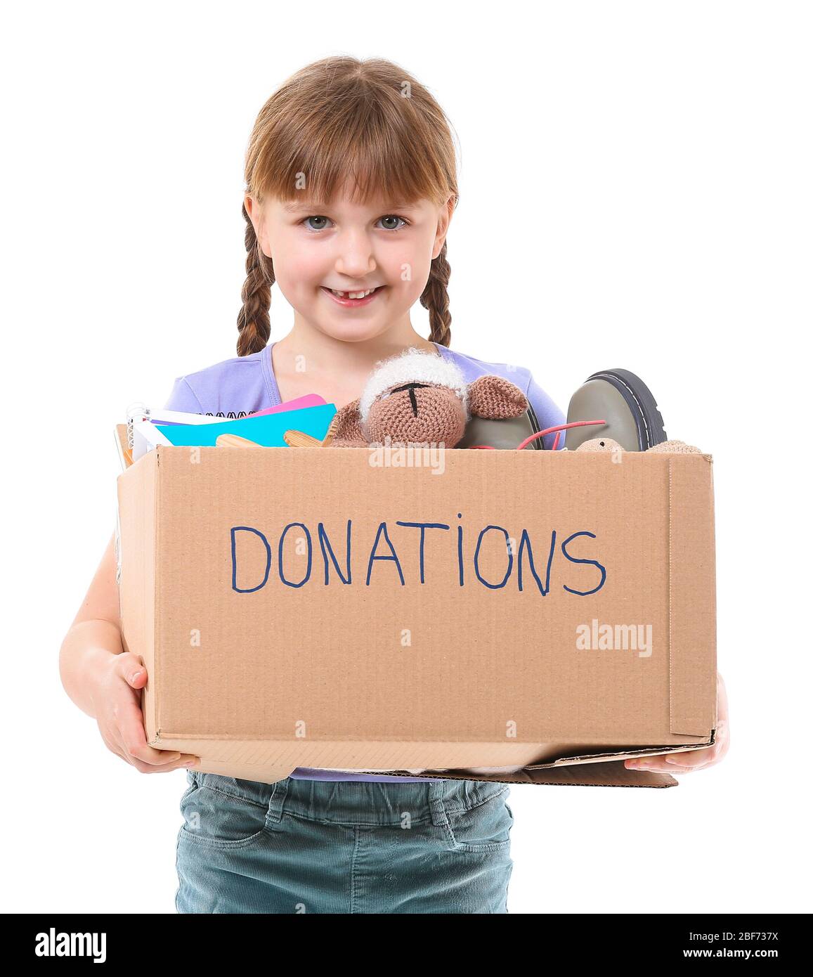 Little girl with donations on white background Stock Photo - Alamy