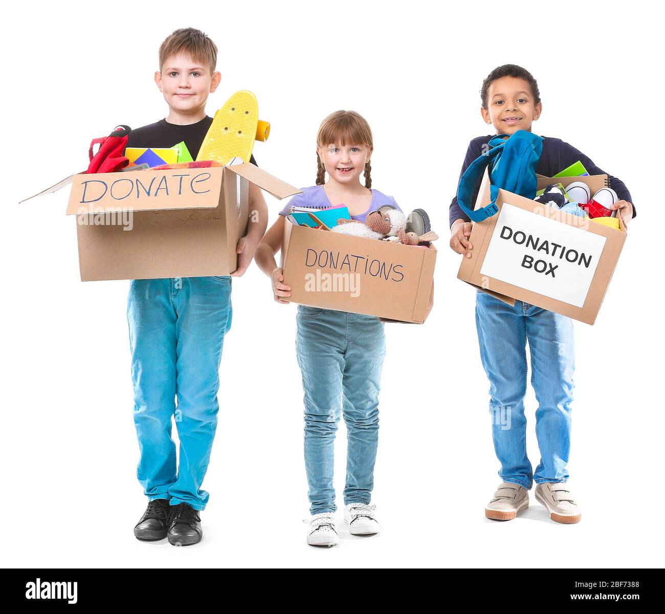 Little children with donations on white background Stock Photo - Alamy