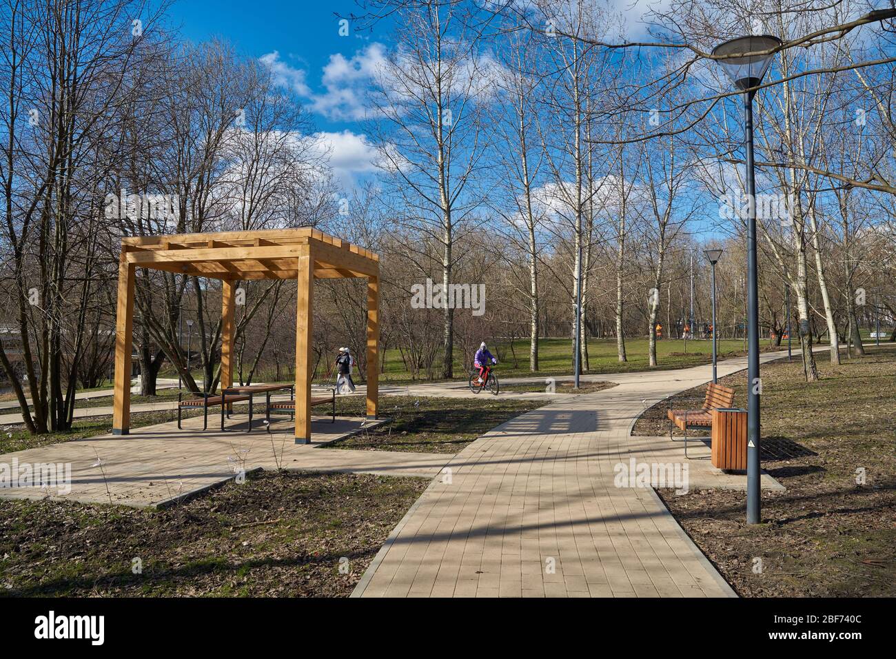 Moscow, Russia - March 22, 2020: Pedestrian walkway and wooden pergola ...