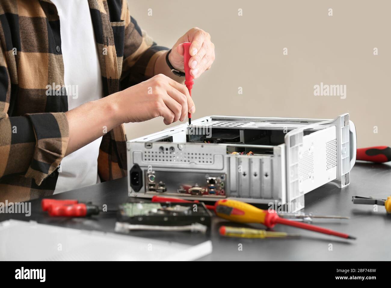 Electronic technician repairing computer hi-res stock photography and ...