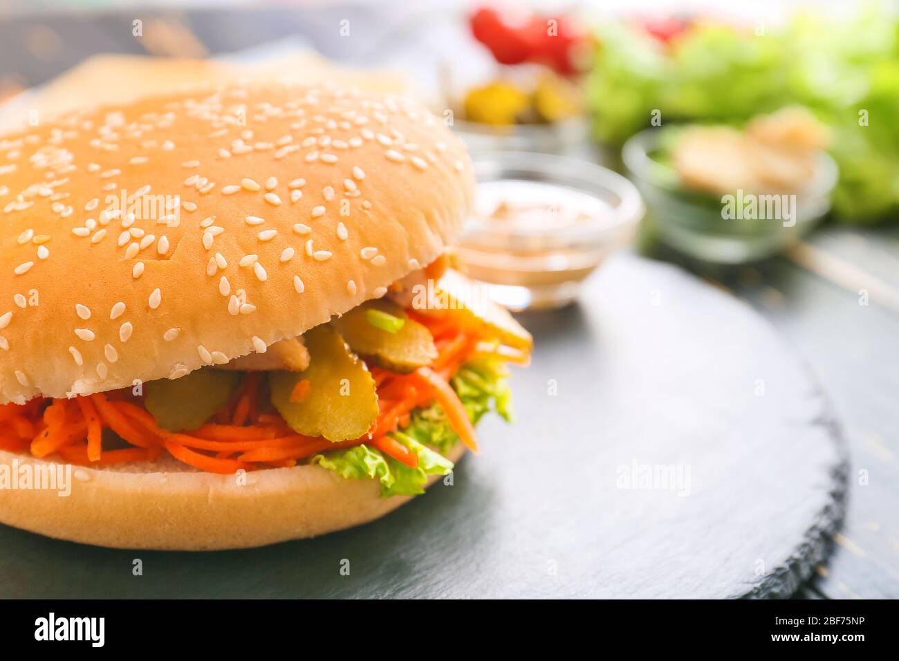 Tasty doner kebab in bun on table, closeup Stock Photo - Alamy