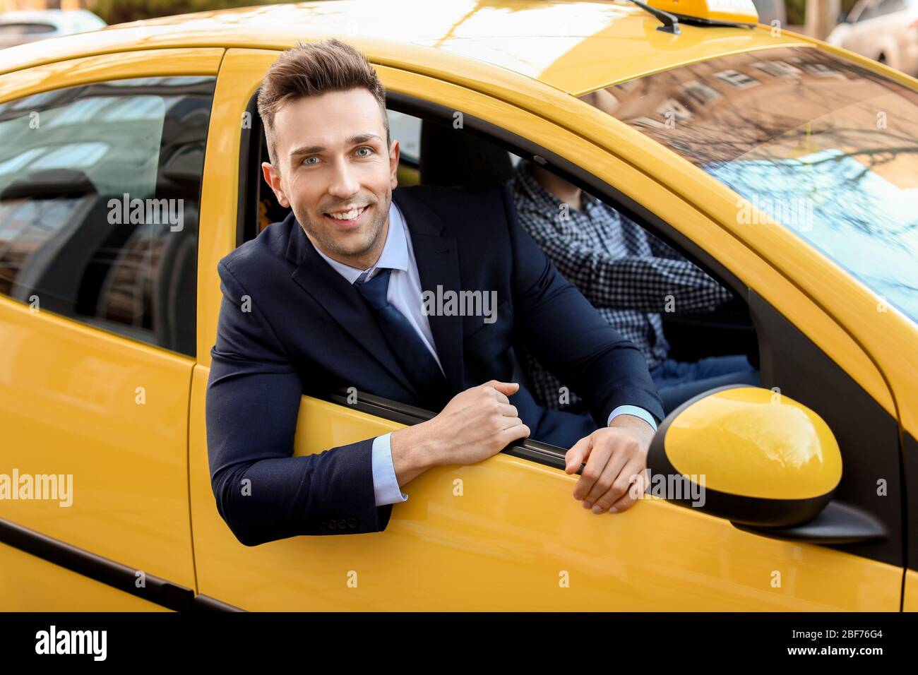 Businessman looking out taxi hi-res stock photography and images - Alamy