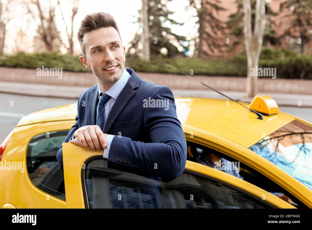 Getting out of taxi cab car hi-res stock photography and images - Alamy