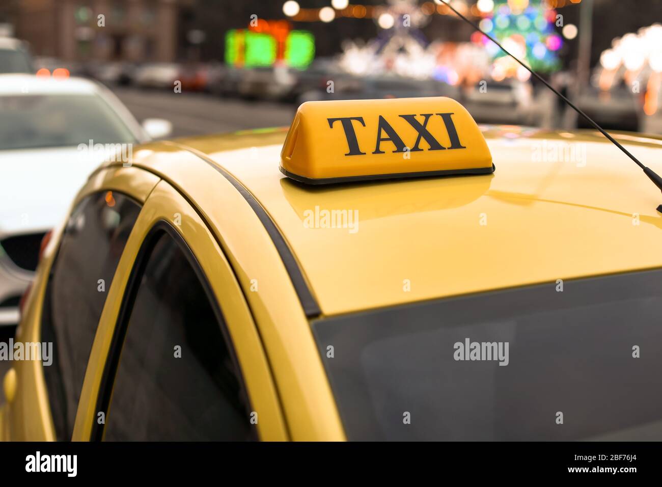 Modern taxi car on city road, closeup Stock Photo - Alamy