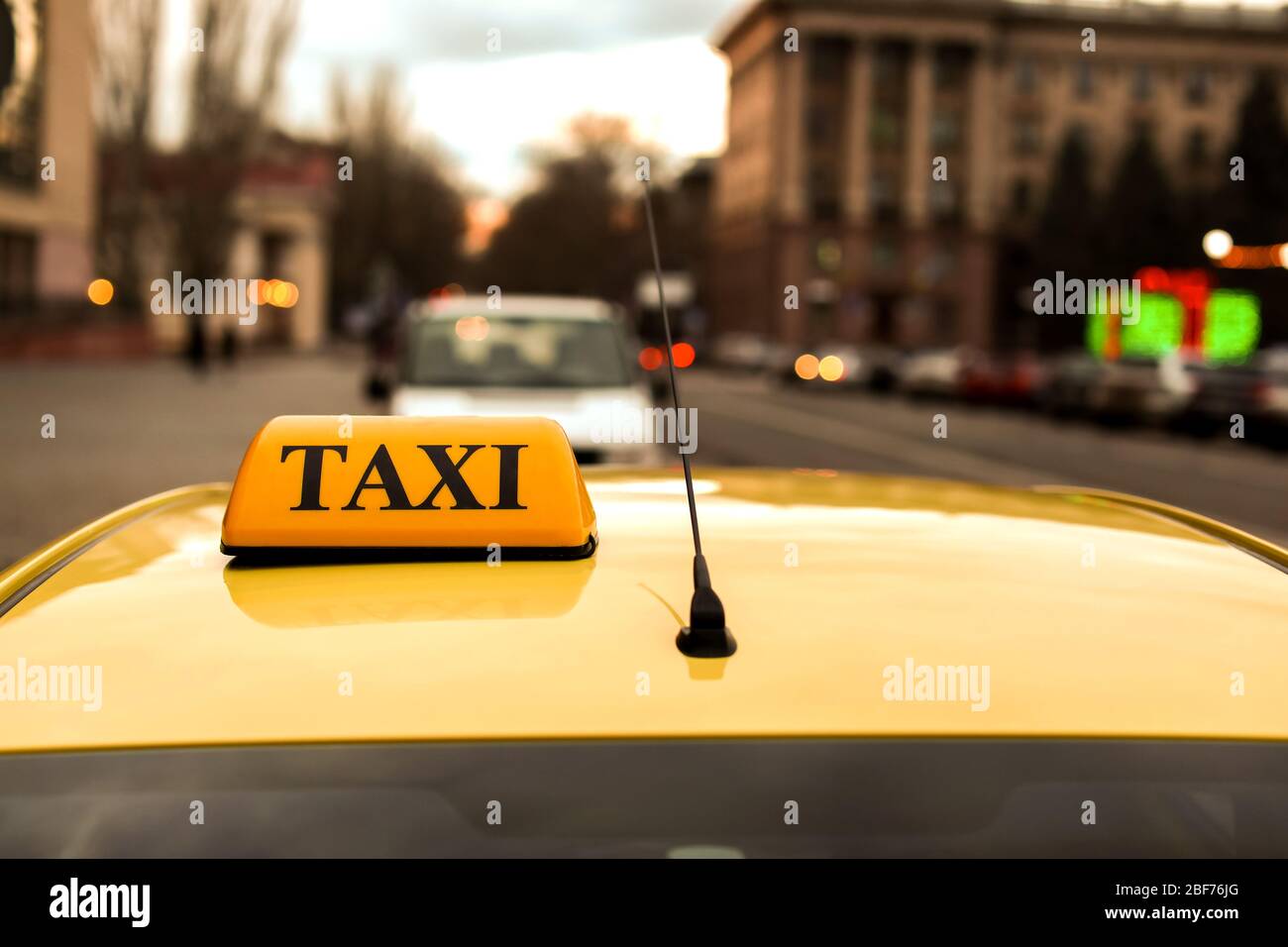 Modern taxi car on city road, closeup Stock Photo - Alamy