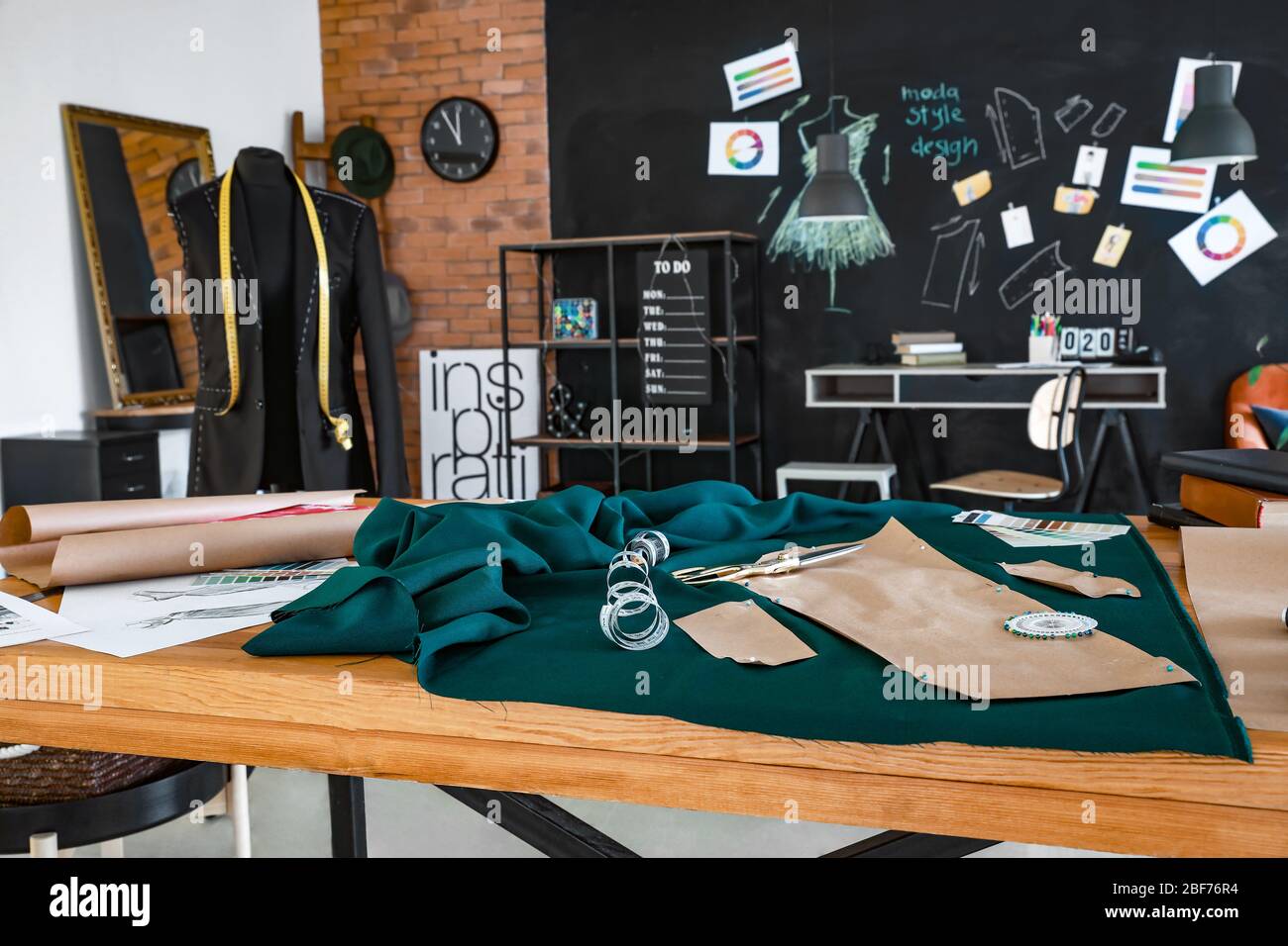 Interior of modern atelier with tailor's workplace Stock Photo - Alamy