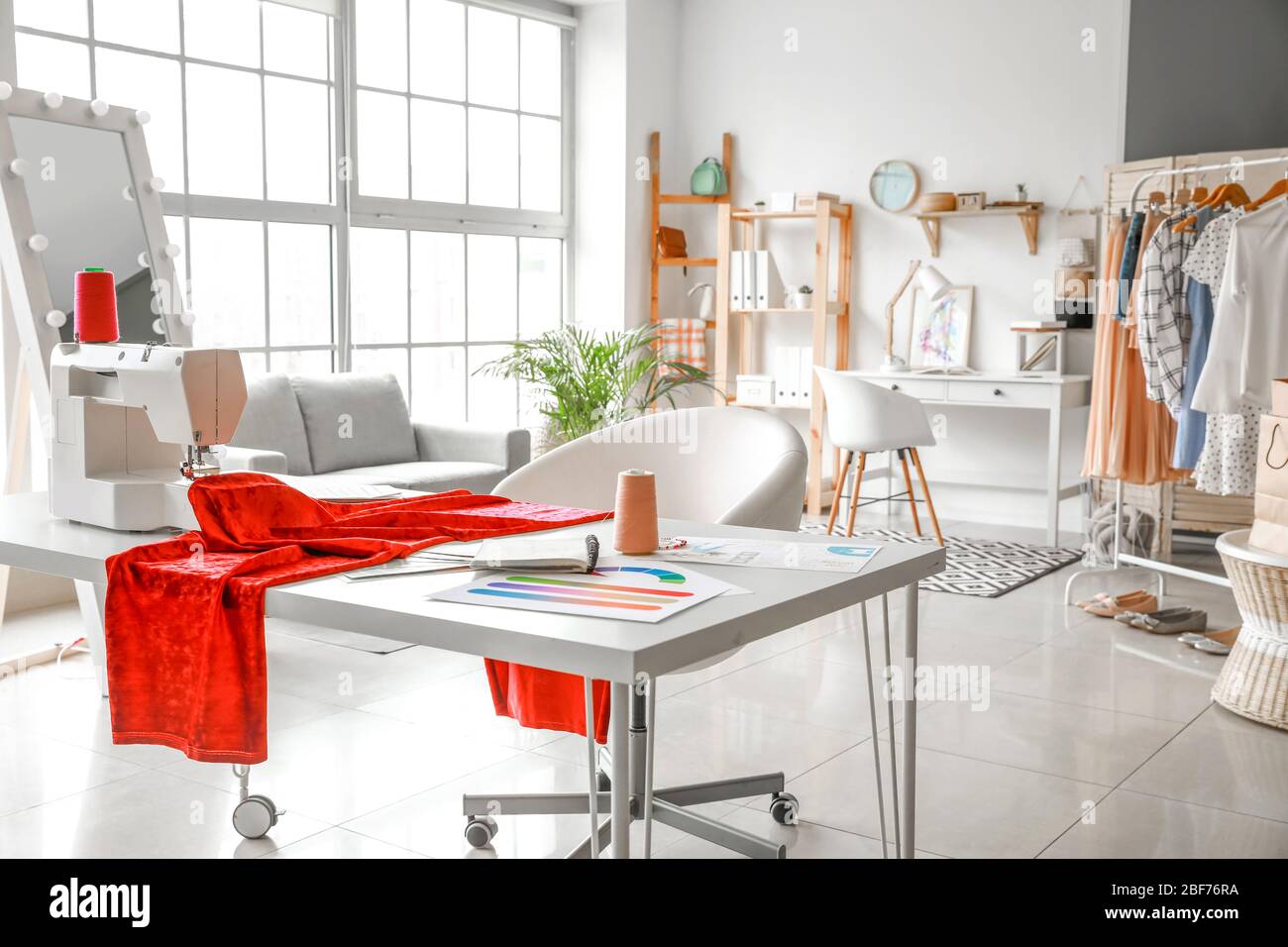 Interior of modern atelier with tailor's workplace Stock Photo - Alamy