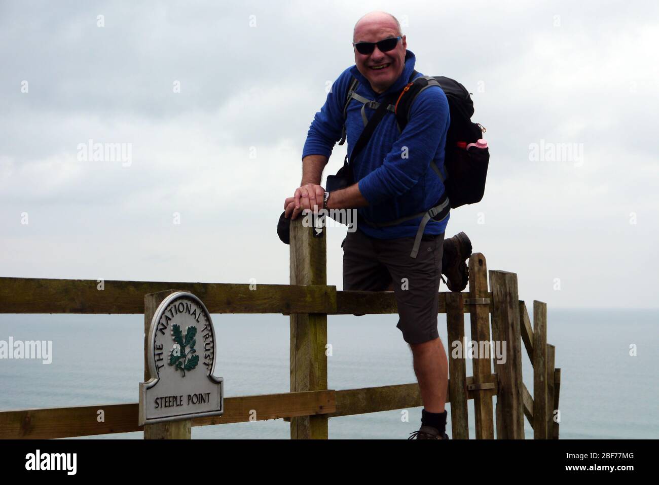 Smiling Man Hiker Climbing Wooden Stile by Metal National Trust ...