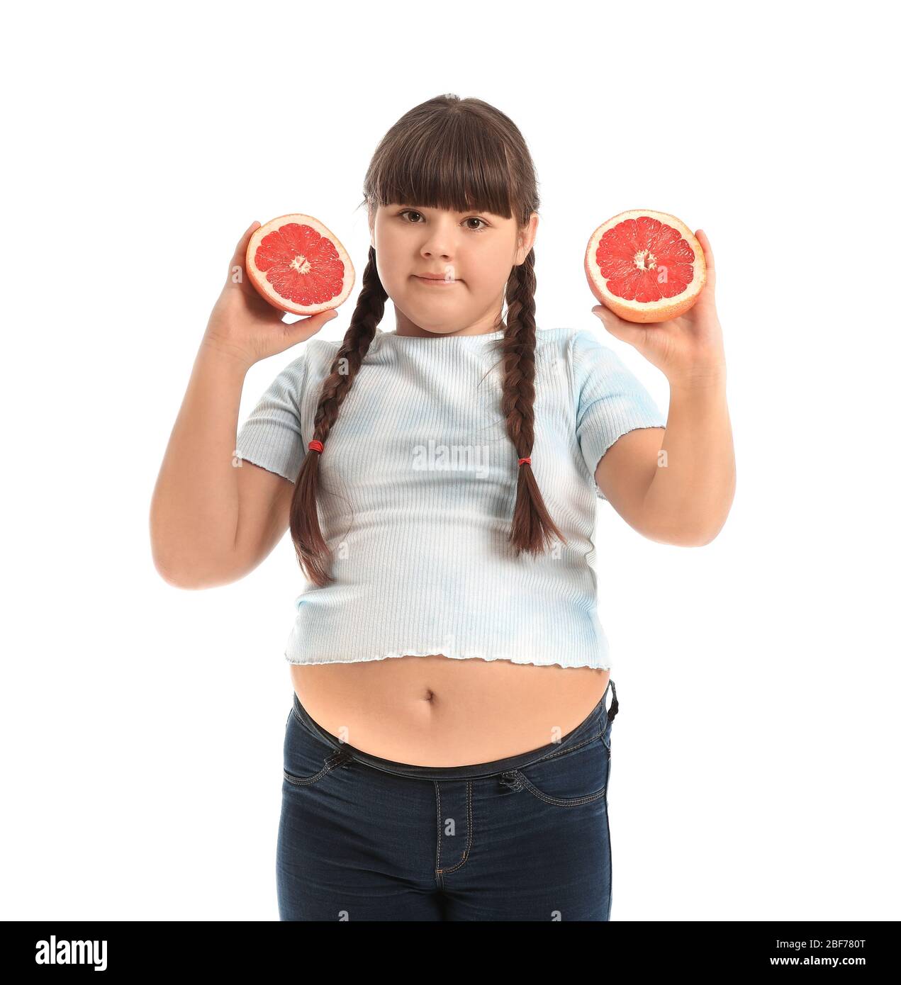 Overweight girl with healthy grapefruit on white background Stock Photo ...