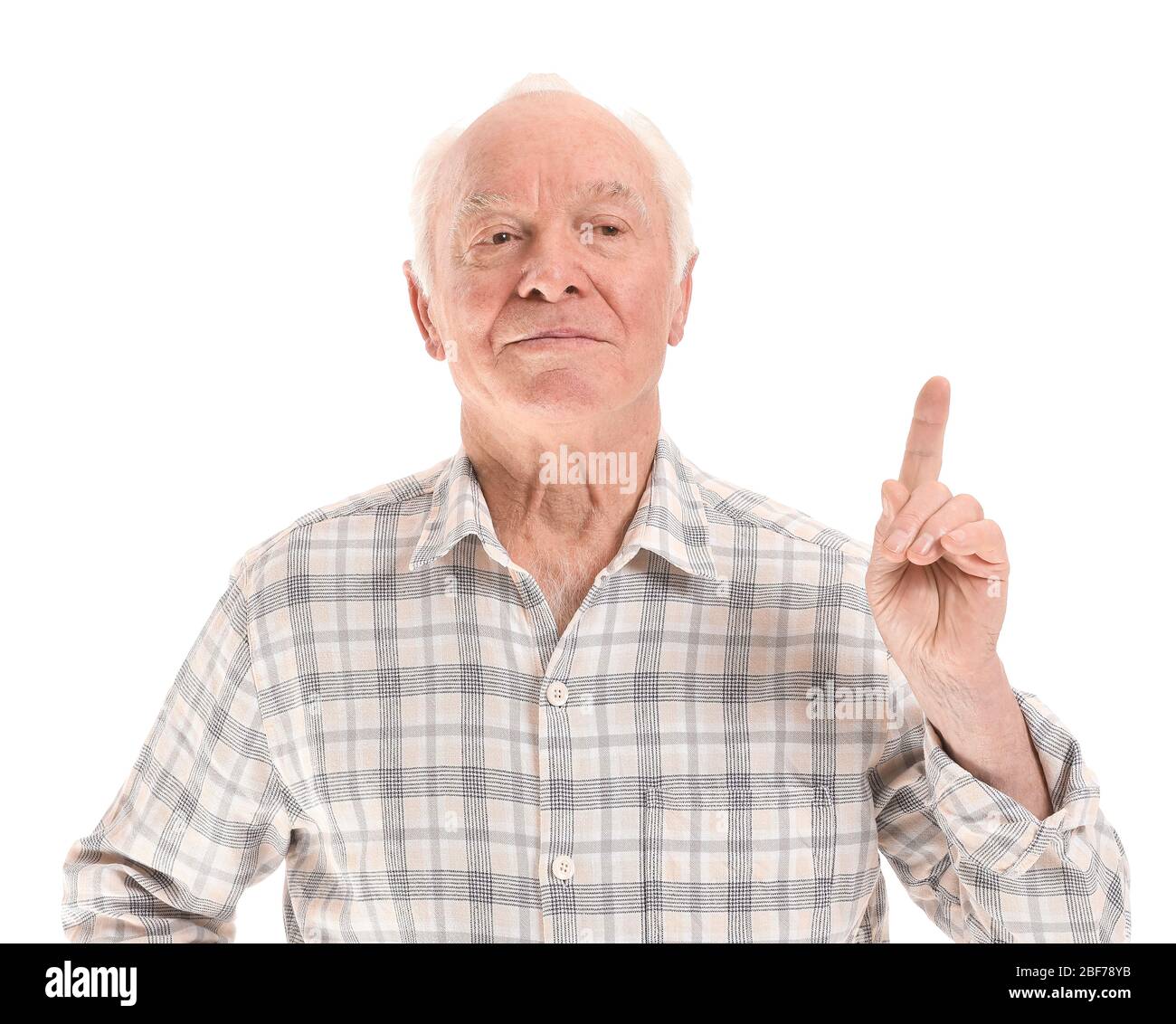 Portrait of elderly man with raised index finger on white background ...