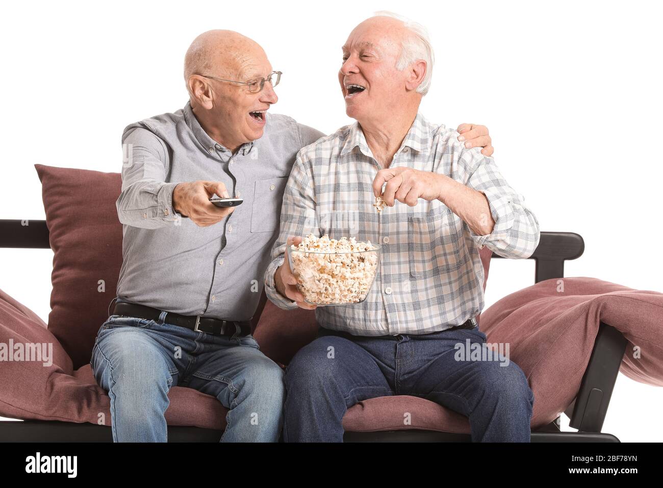 Portrait of elderly men watching TV on white background Stock Photo - Alamy