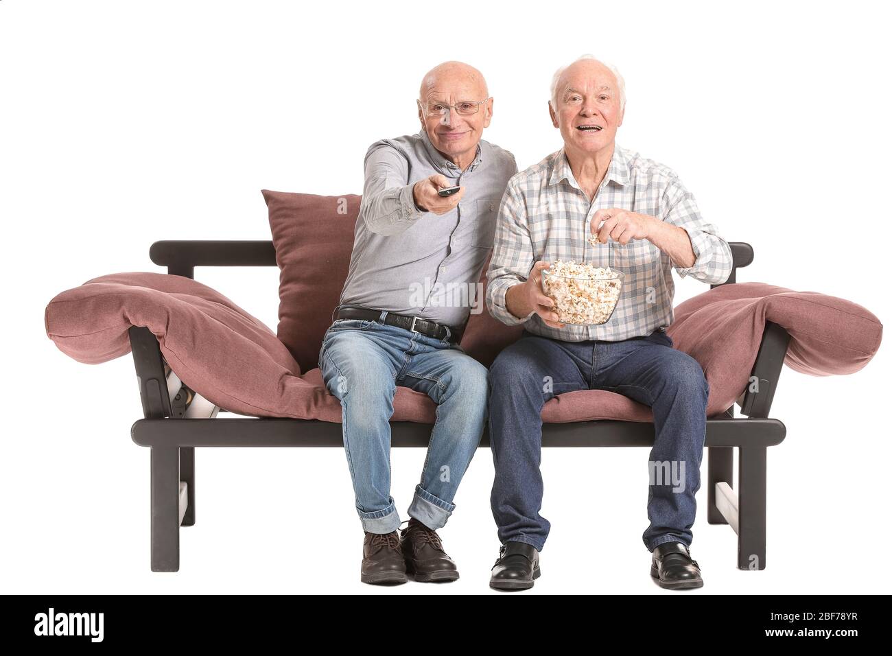 Portrait of elderly men watching TV on white background Stock Photo - Alamy