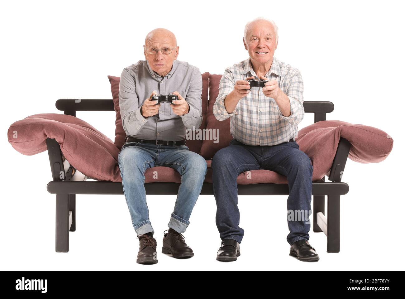 Portrait of elderly men playing video games on white background Stock ...