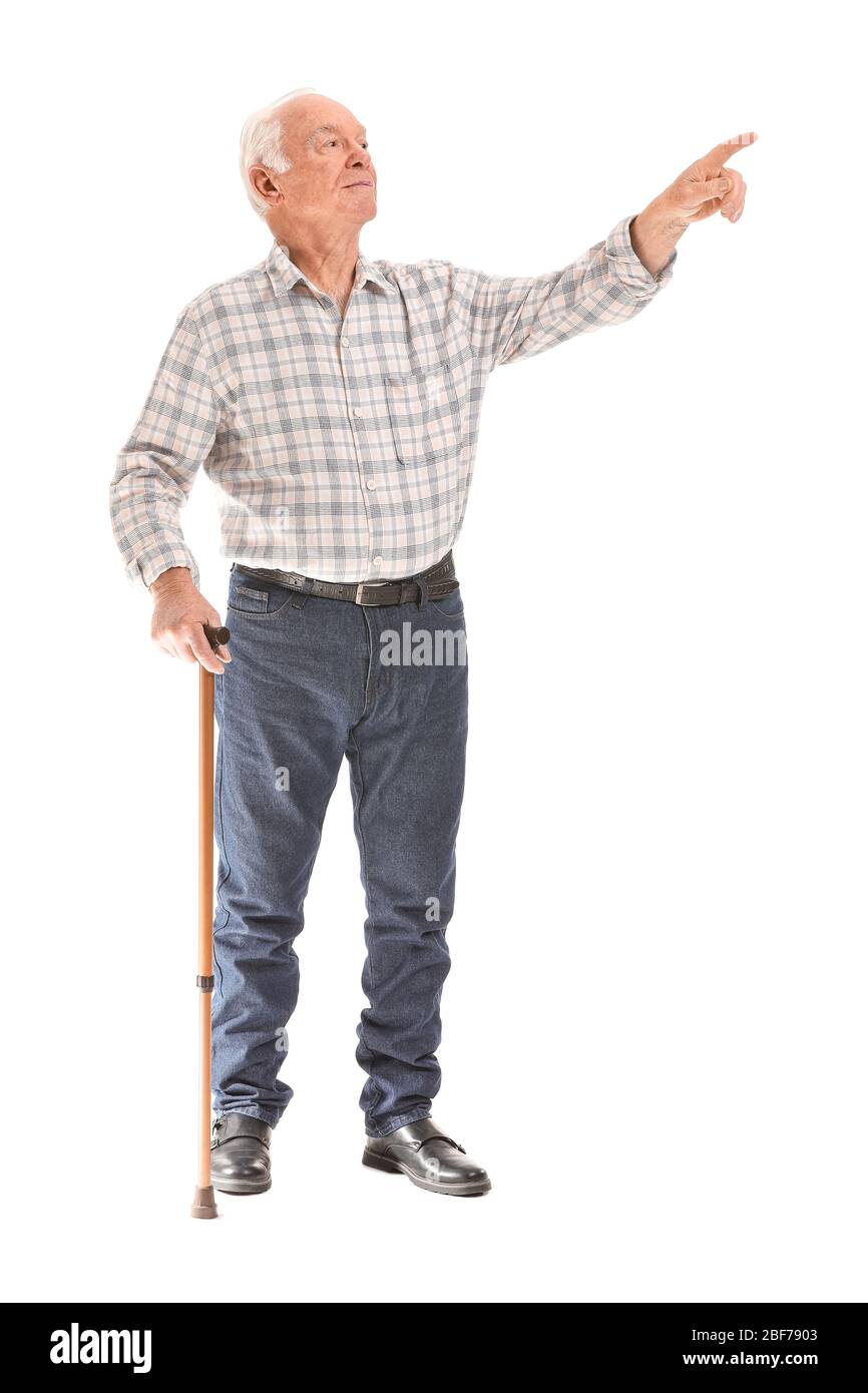 Portrait of elderly man with walking stick showing something on white ...