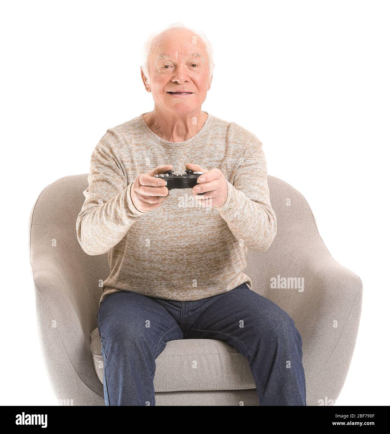Portrait of elderly man playing video games on white background Stock ...