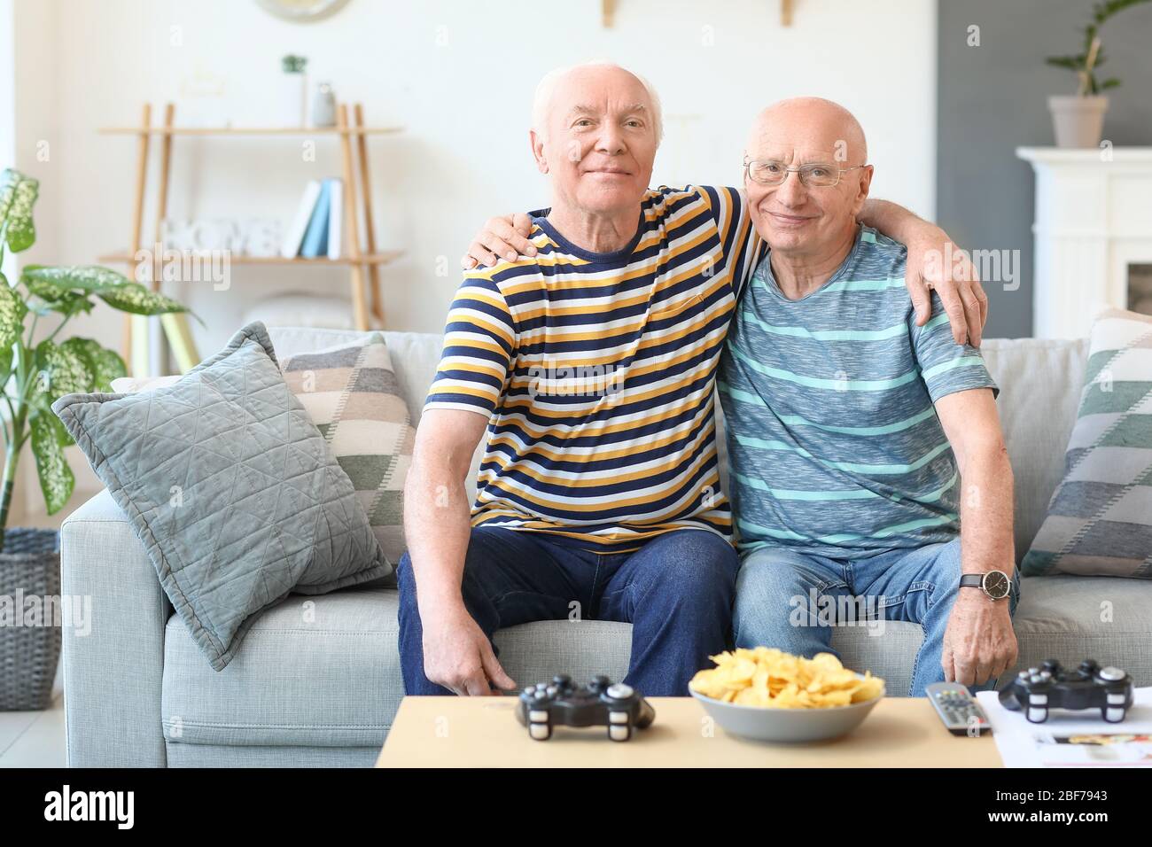 Elderly men resting together at home Stock Photo - Alamy