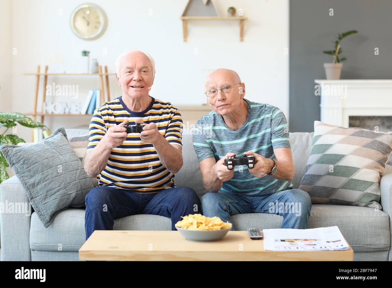 Elderly playing video games hi-res stock photography and images - Alamy