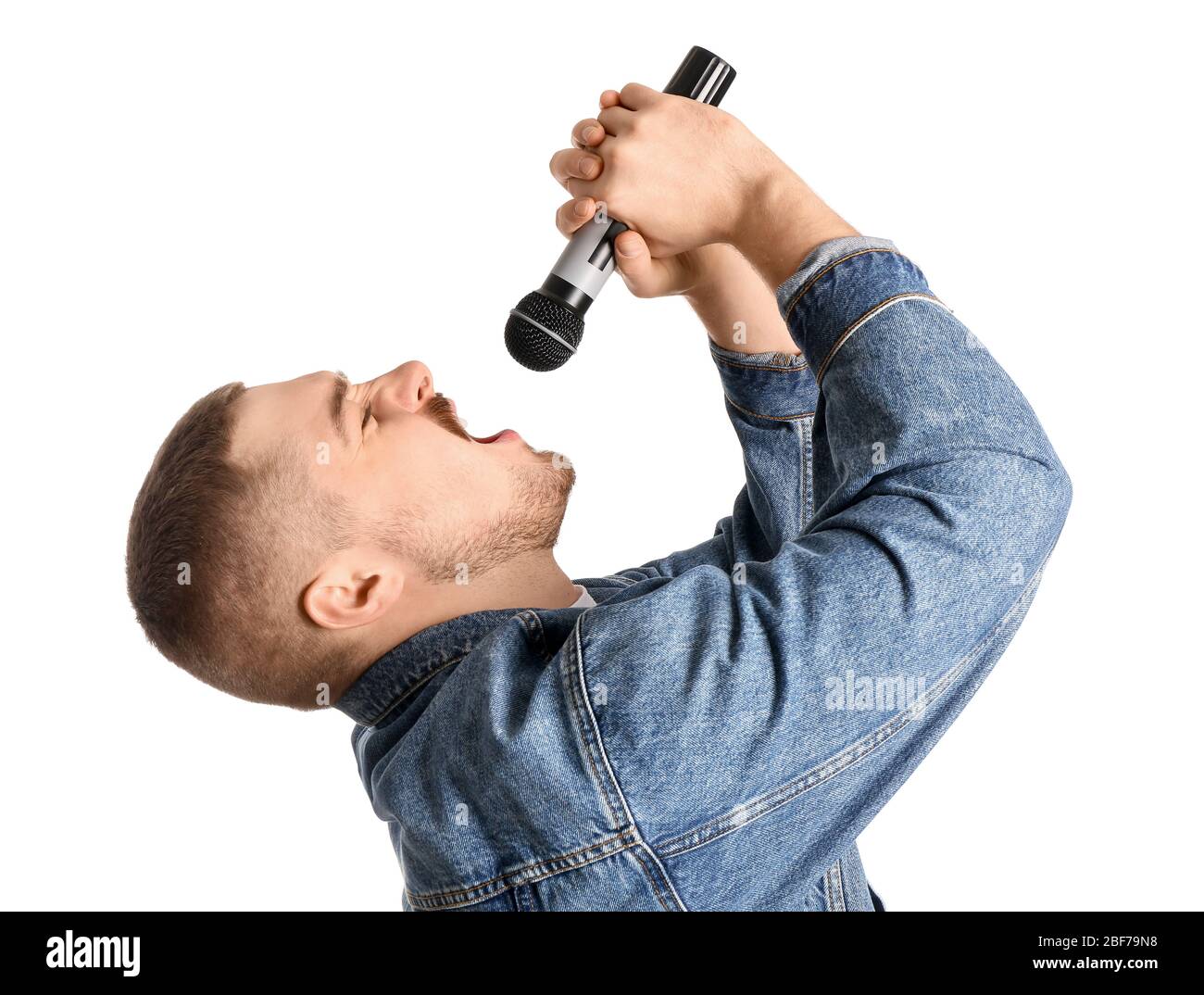 Young male singer on white background Stock Photo - Alamy