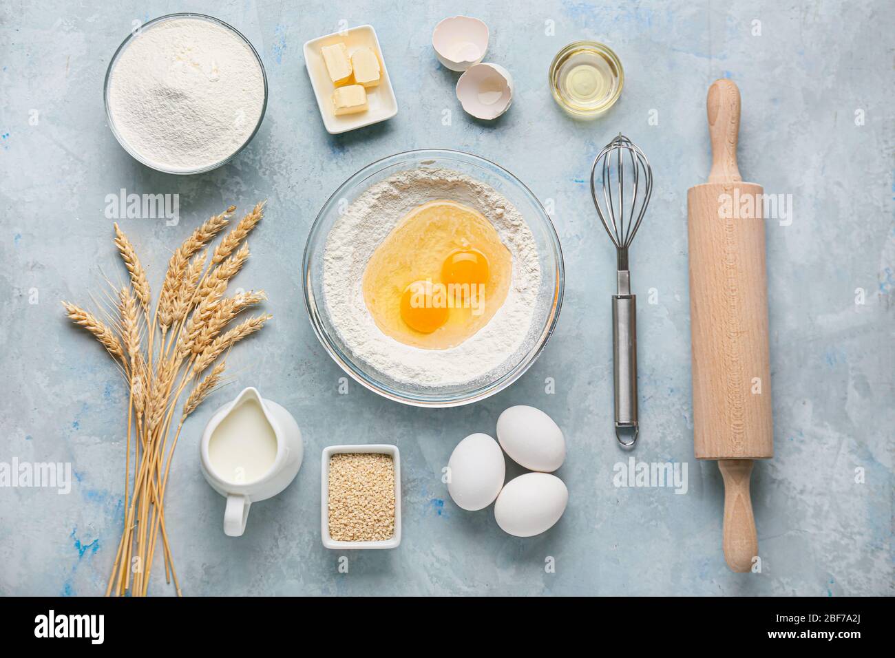 Ingredients for preparing bakery and utensils on color background Stock ...