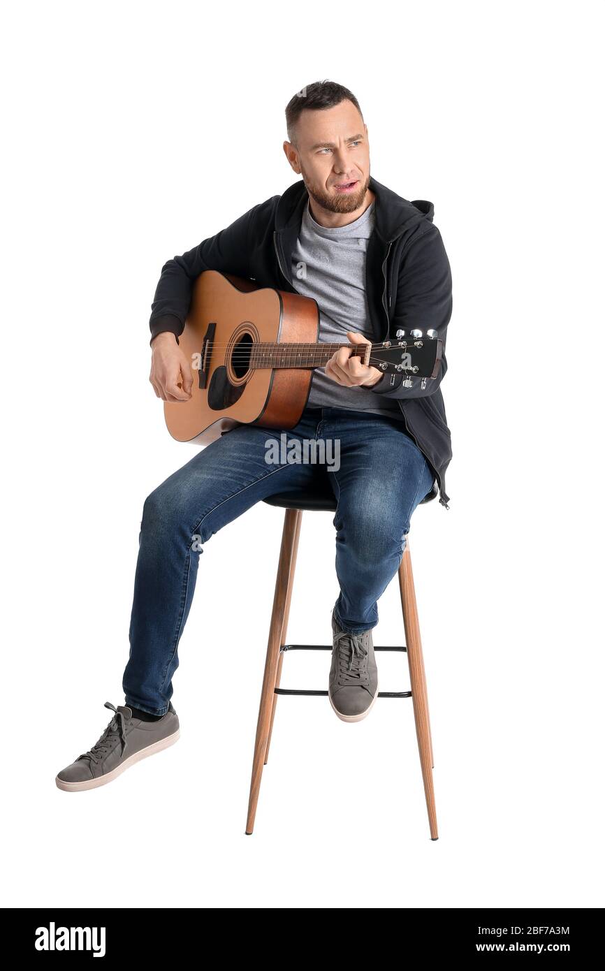 Male singer with guitar on white background Stock Photo - Alamy