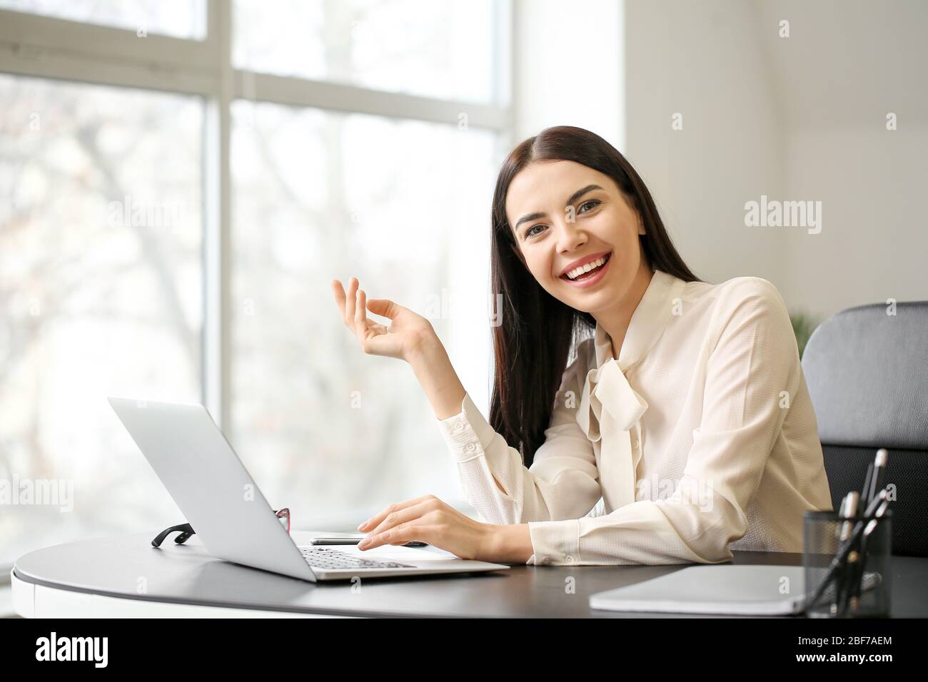 Female accountant working in office Stock Photo - Alamy