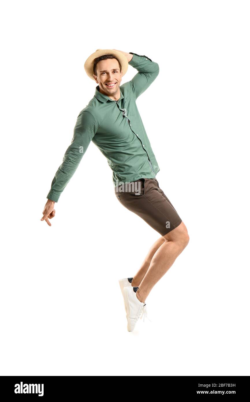 Cool young man dancing against white background Stock Photo - Alamy