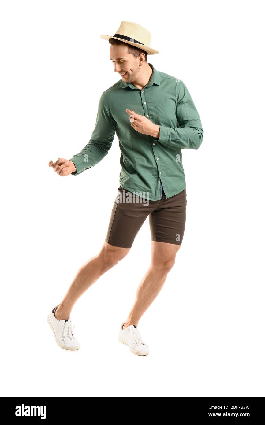 Cool young man dancing against white background Stock Photo - Alamy