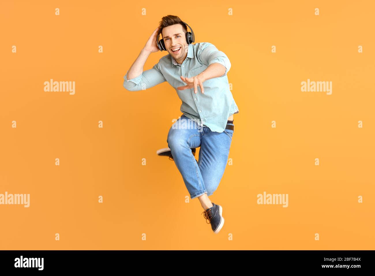 Portrait man headphones jumping dancing hi-res stock photography and ...