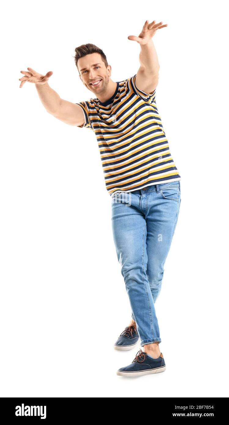 Cool young man dancing against white background Stock Photo - Alamy