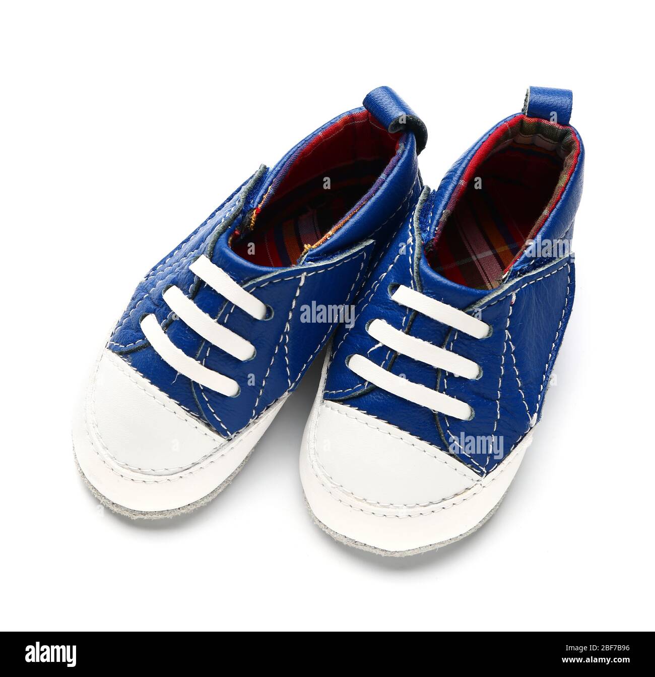 Baby booties on white background Stock Photo - Alamy