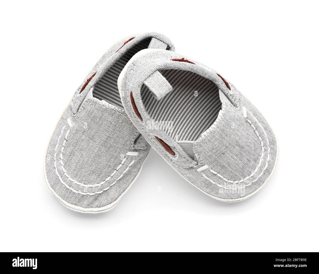 Baby booties on white background Stock Photo - Alamy