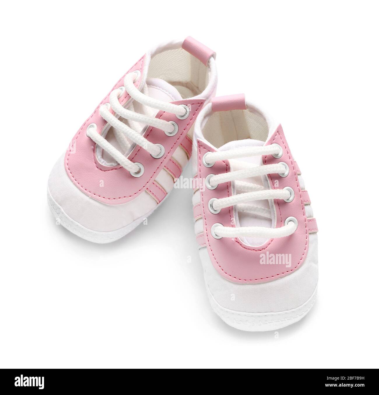 Baby booties on white background Stock Photo - Alamy