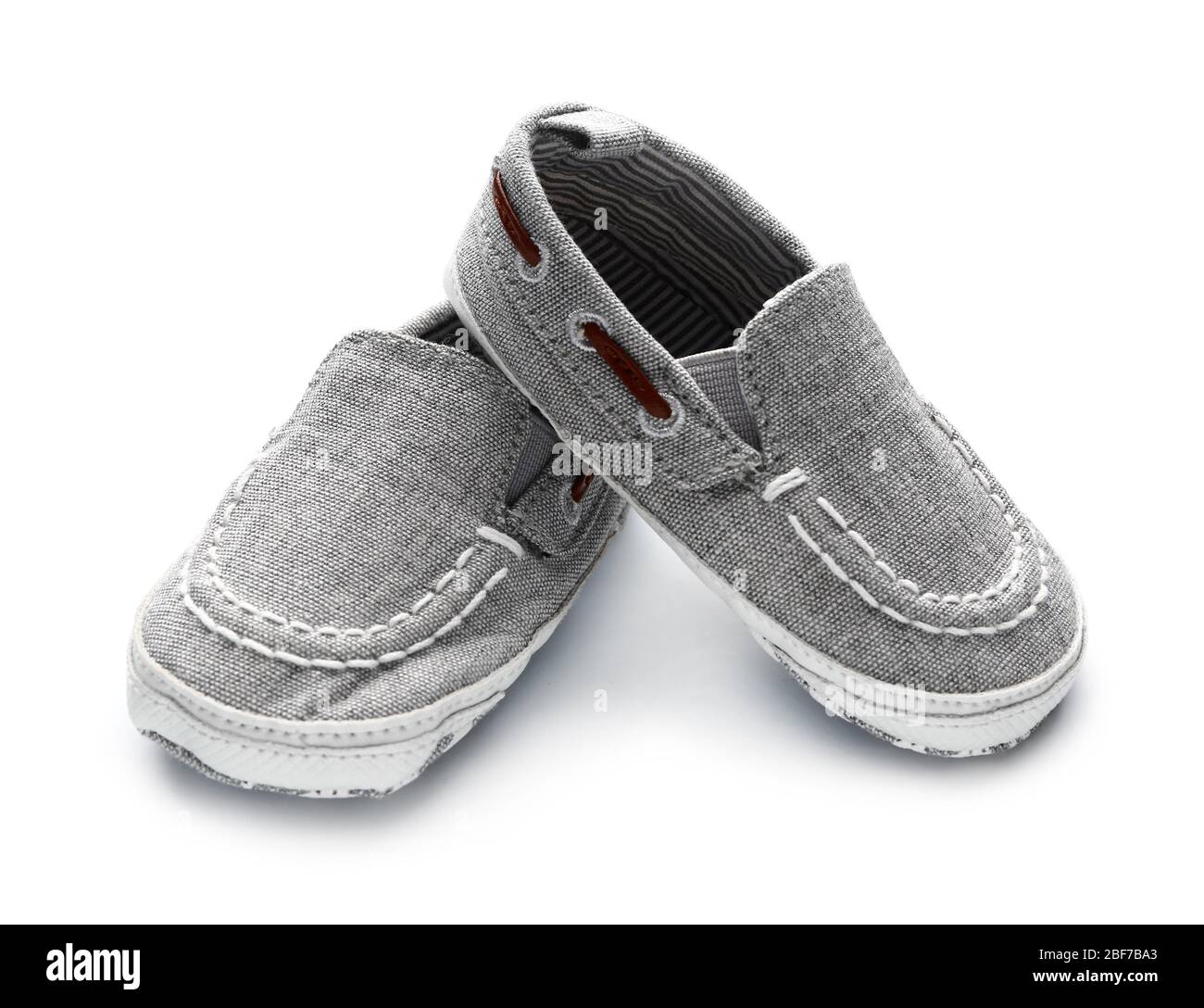 Baby booties on white background Stock Photo - Alamy