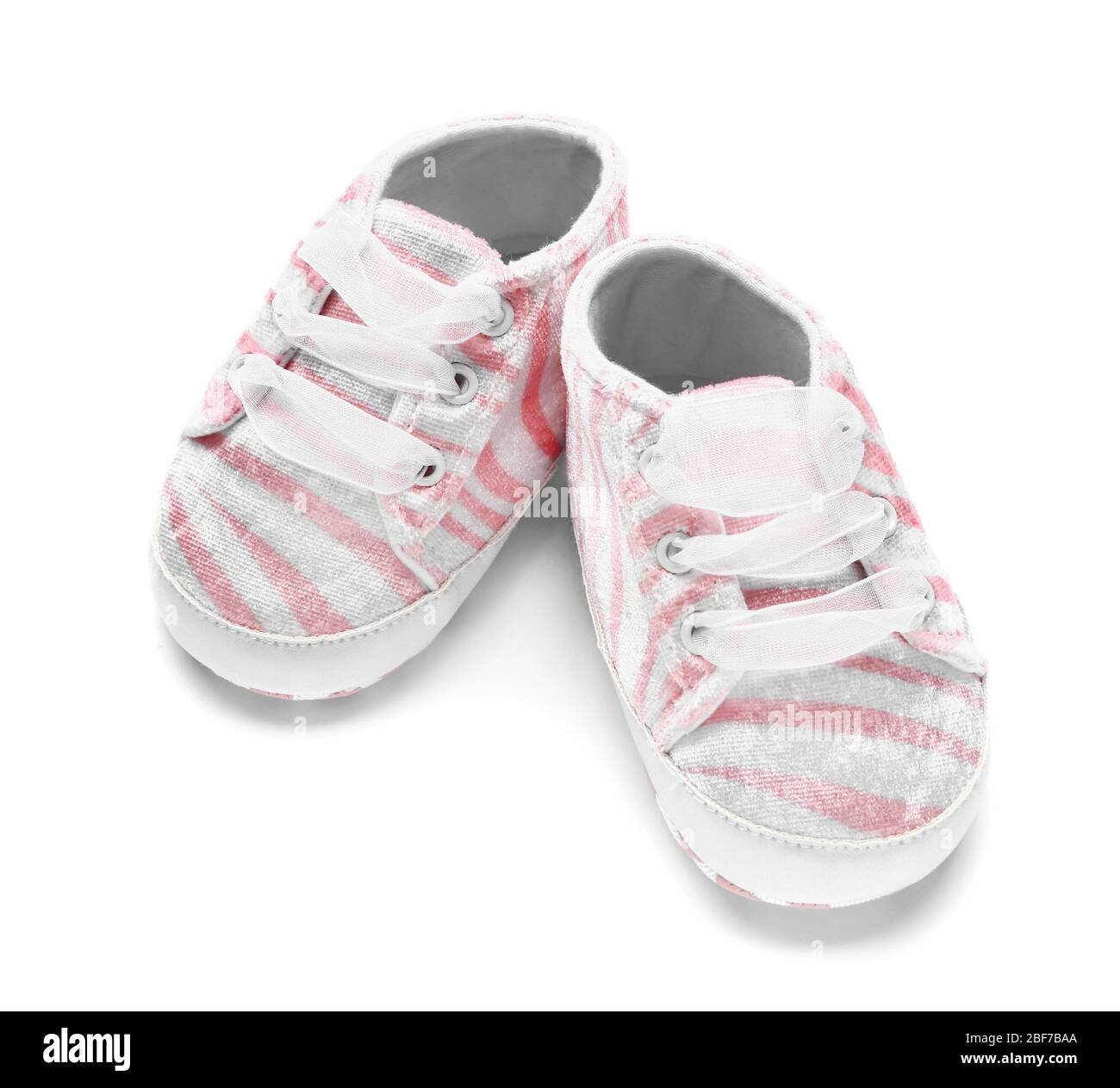 Baby booties on white background Stock Photo - Alamy