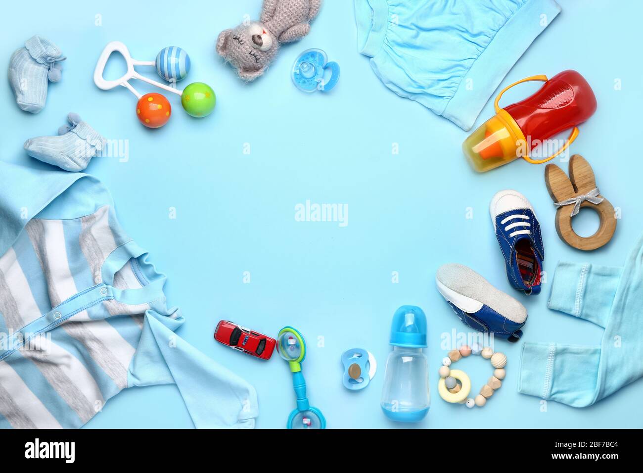 Frame made of baby clothes and accessories on color background Stock ...