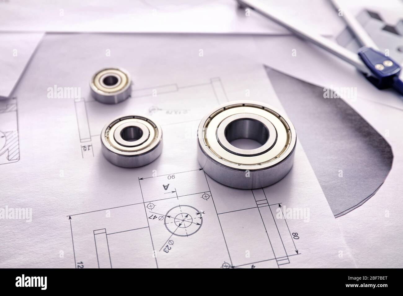Bearings and drawings on table of engineer Stock Photo - Alamy