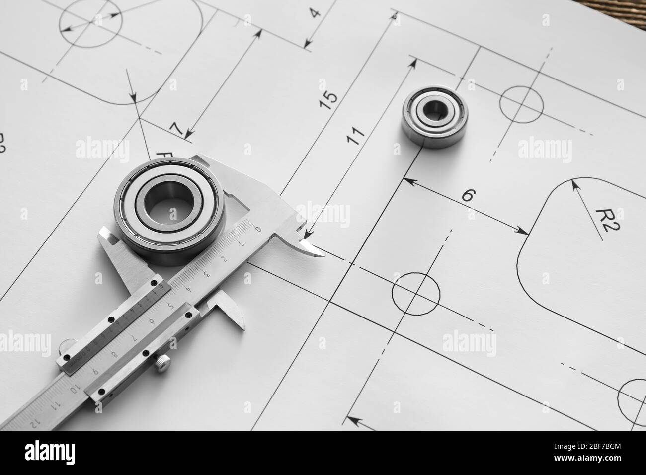 Bearings with vernier caliper and drawings on table of engineer Stock ...