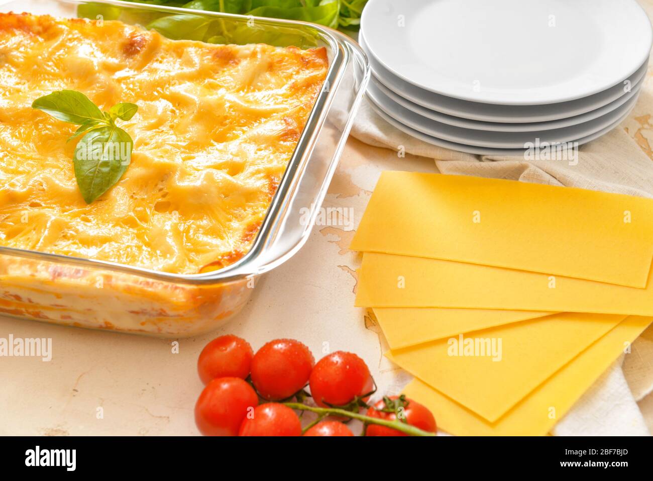 Composition with tasty homemade lasagna on table Stock Photo - Alamy