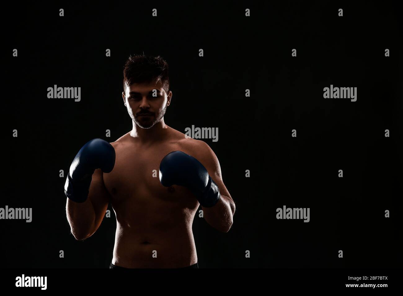 Silhouette of male boxer on dark background Stock Photo - Alamy