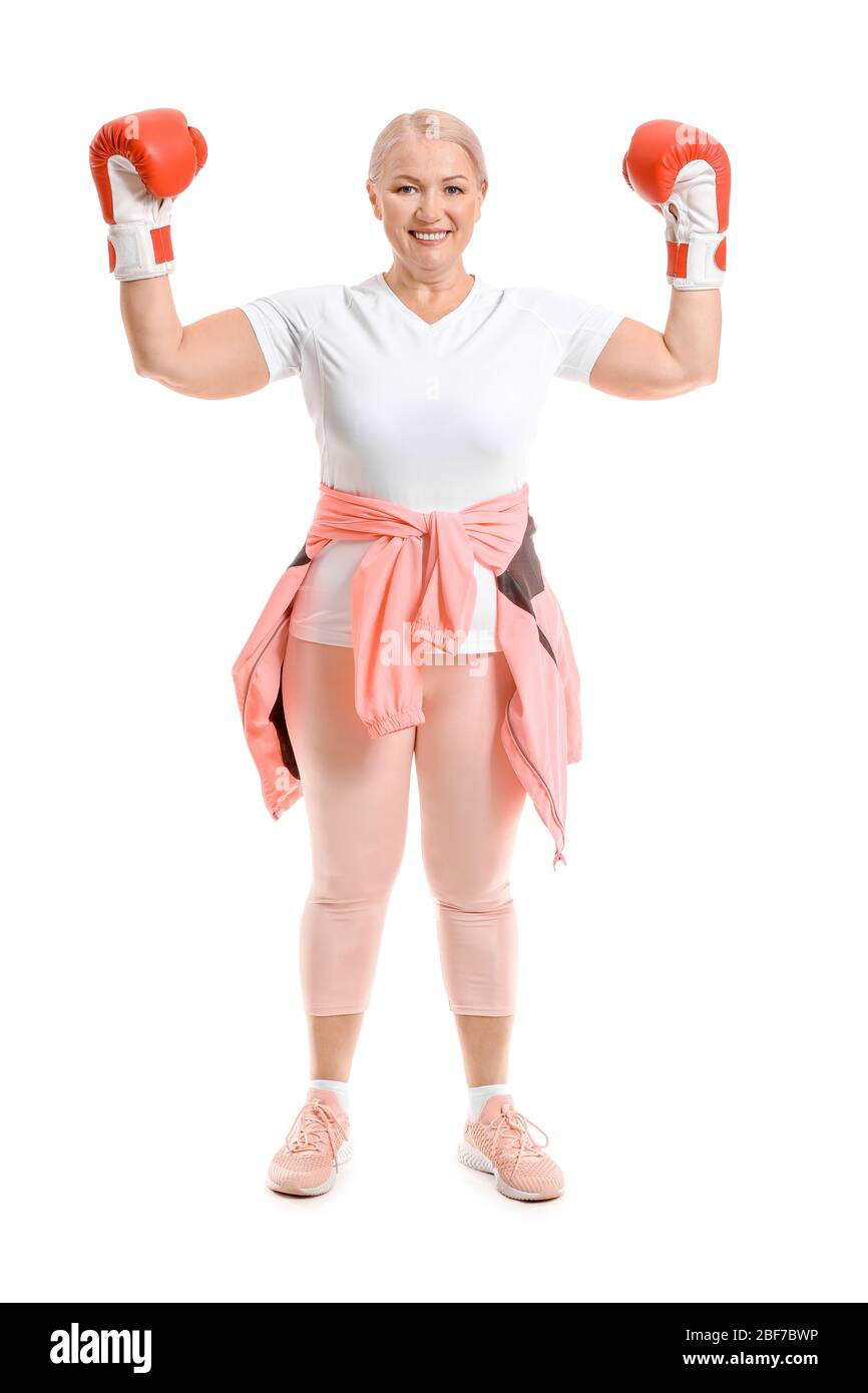 Sporty mature female boxer on white background Stock Photo - Alamy