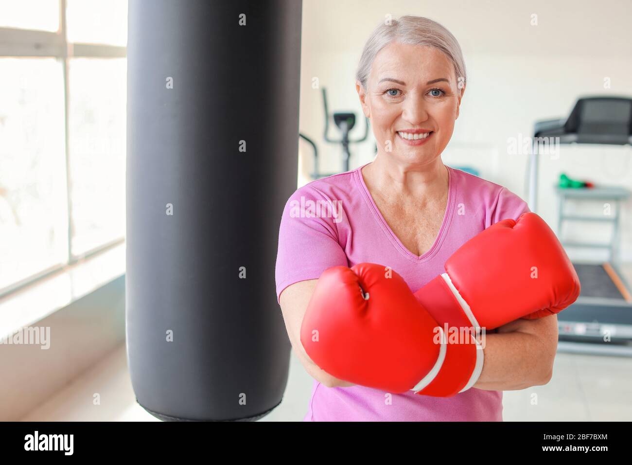 Sporty mature female boxer in gym Stock Photo - Alamy