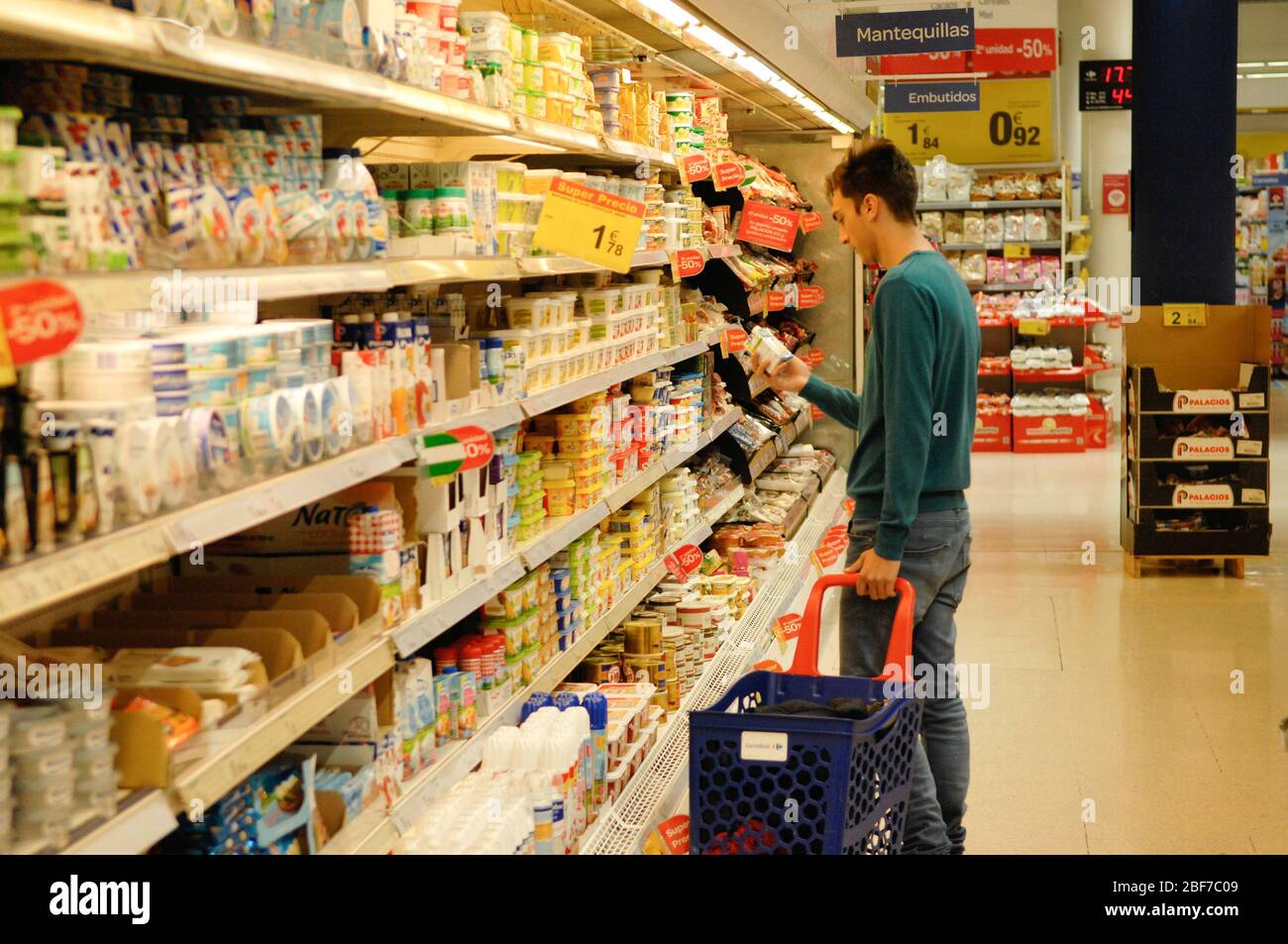 a customer picking up a Dairy product Stock Photo - Alamy