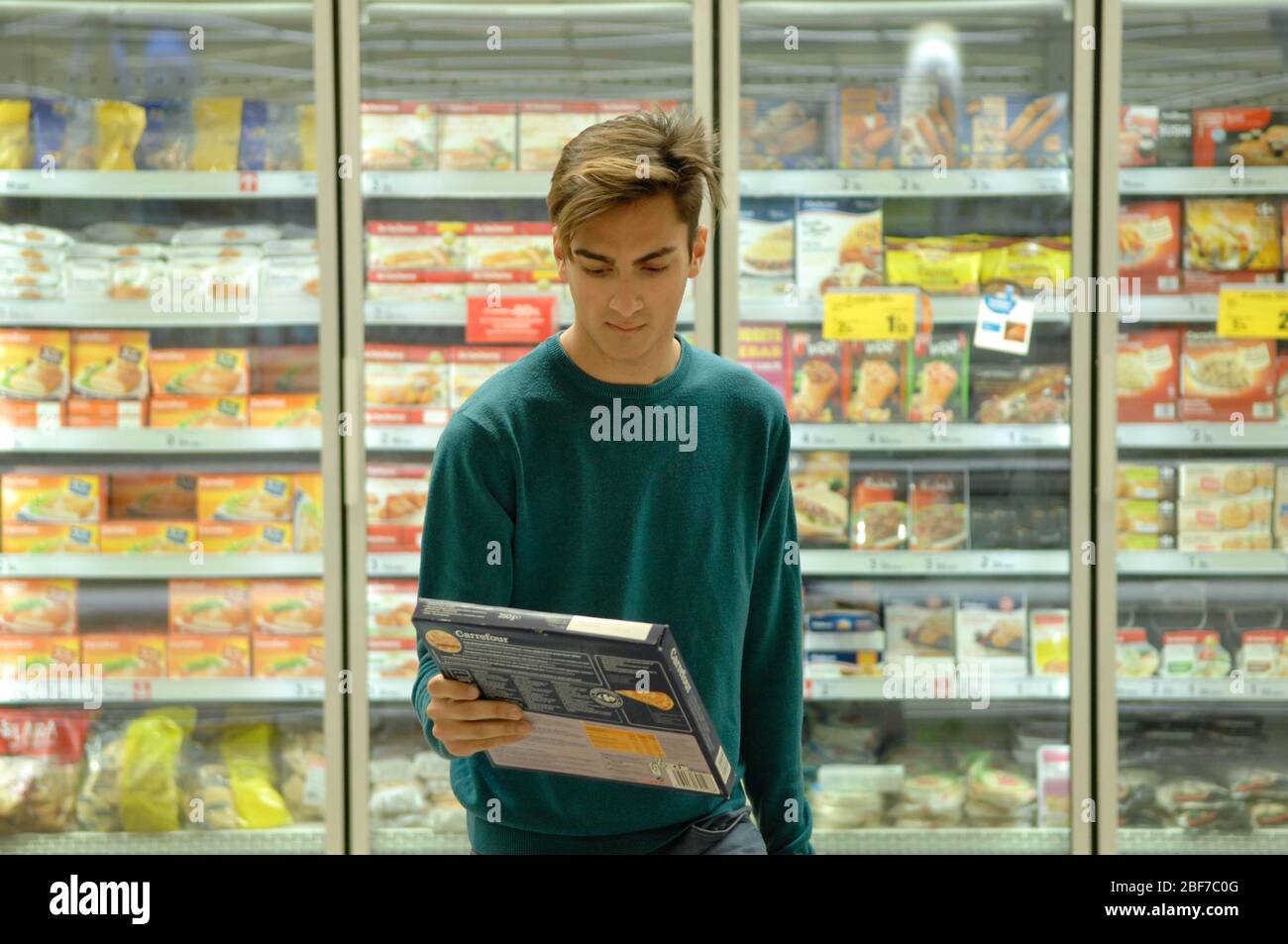 a customer picking up a frozen food Stock Photo - Alamy