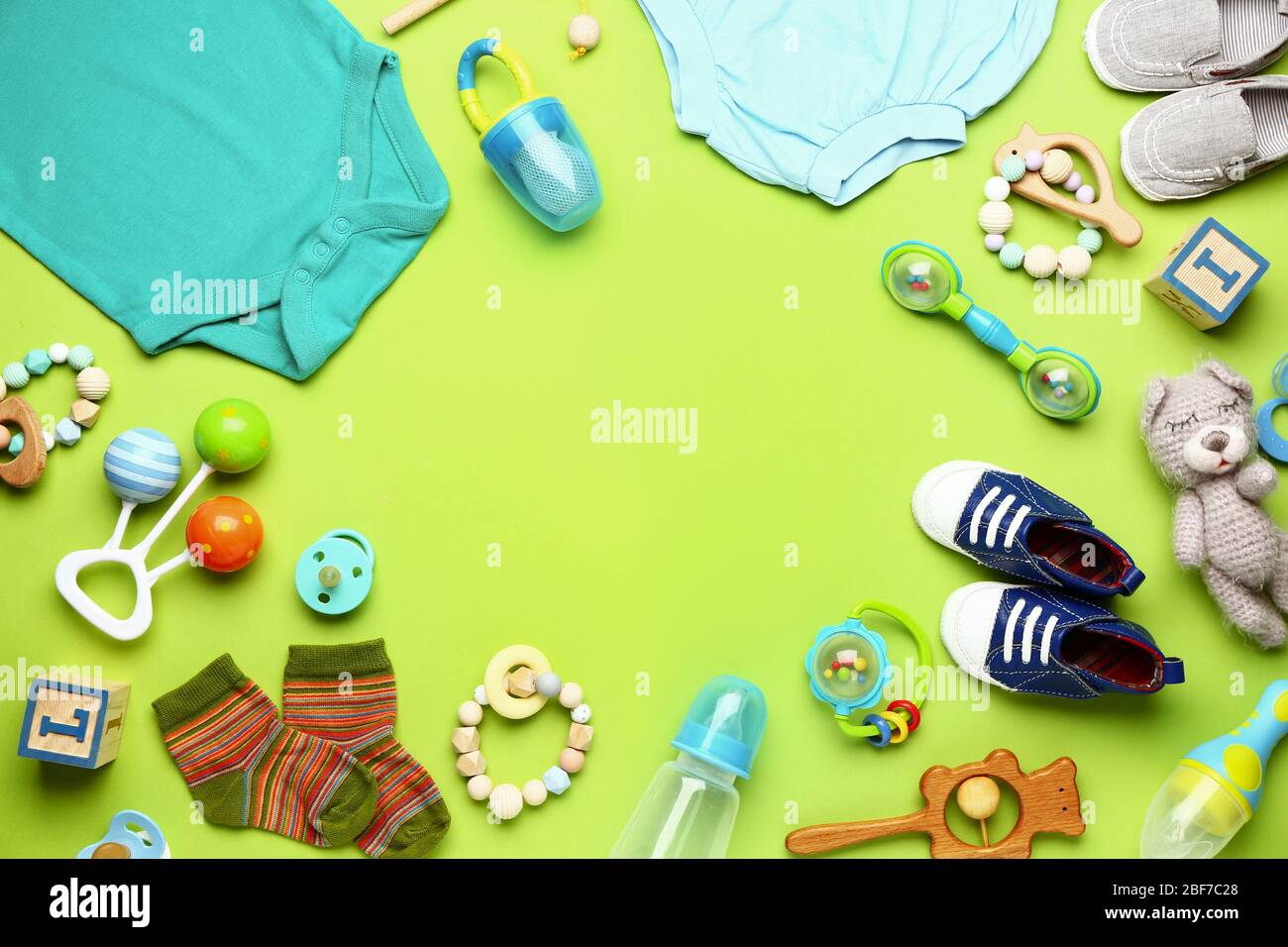 Frame made of baby clothes and accessories on color background Stock ...