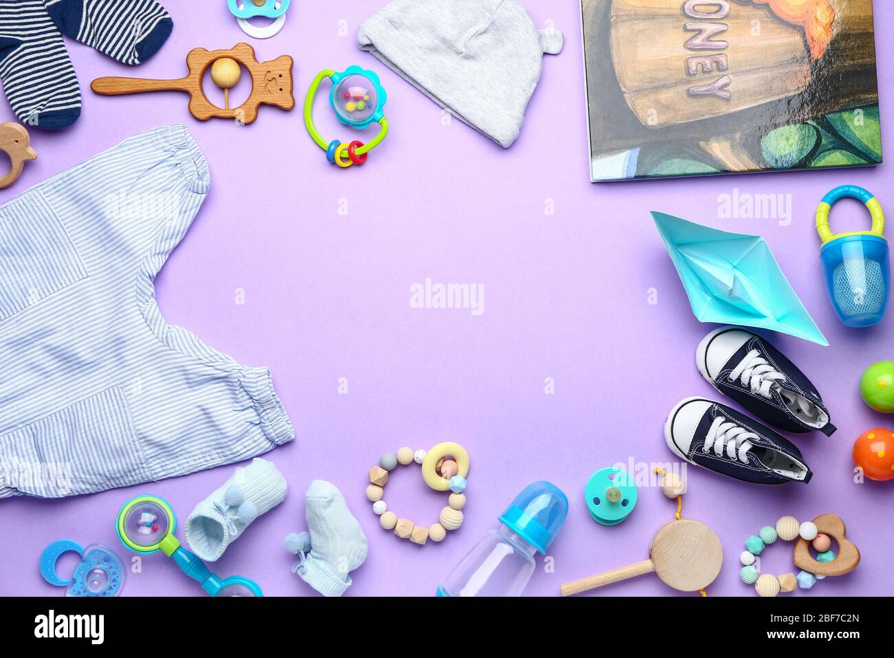 Frame made of baby clothes and accessories on color background Stock ...
