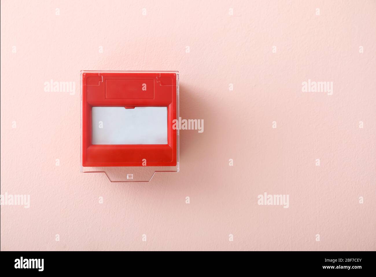 Modern manual call point on color background Stock Photo - Alamy