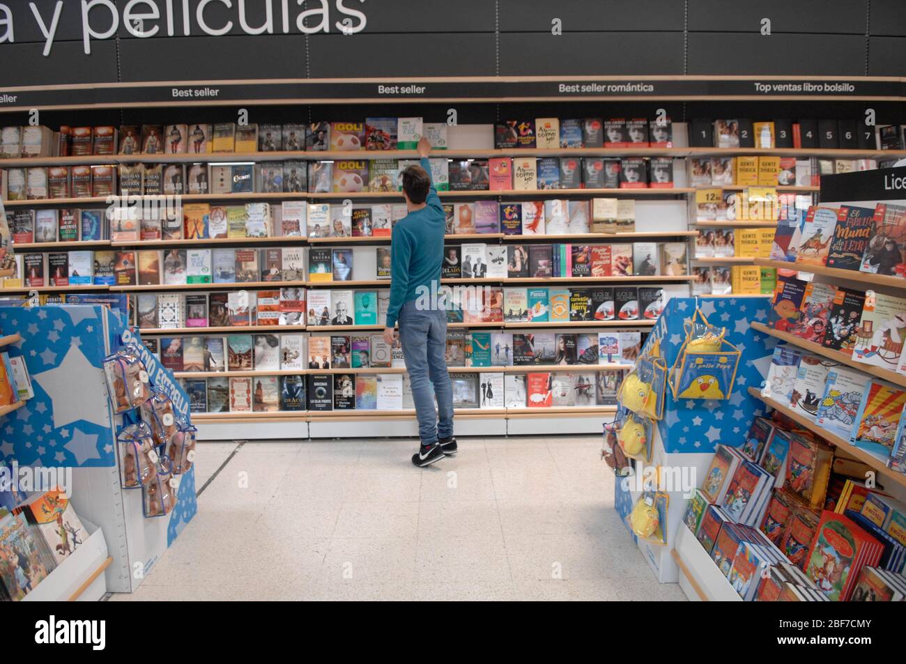 a customer picking up a book Stock Photo - Alamy