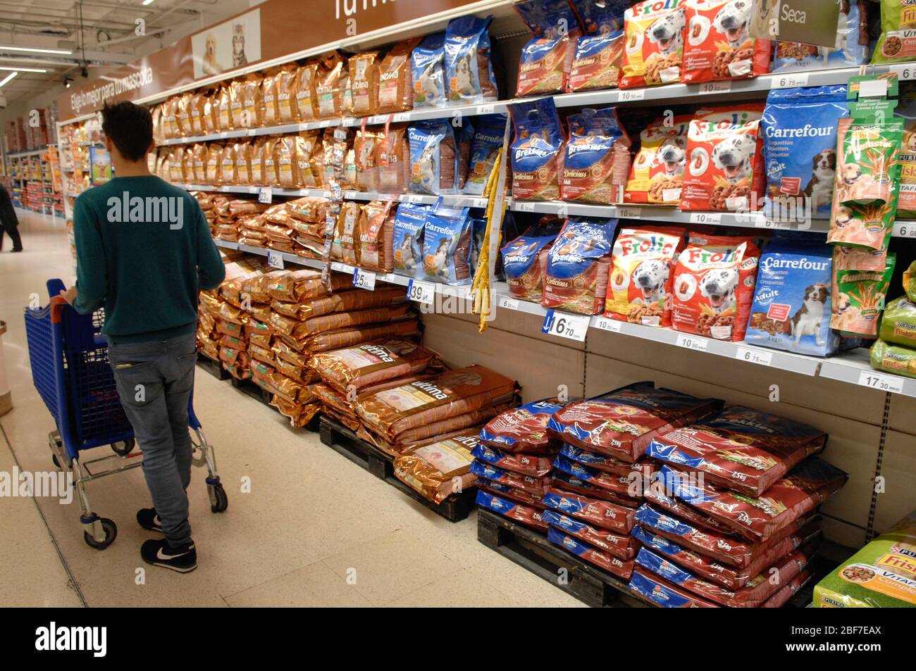 a customer going through an animal food section Stock Photo - Alamy