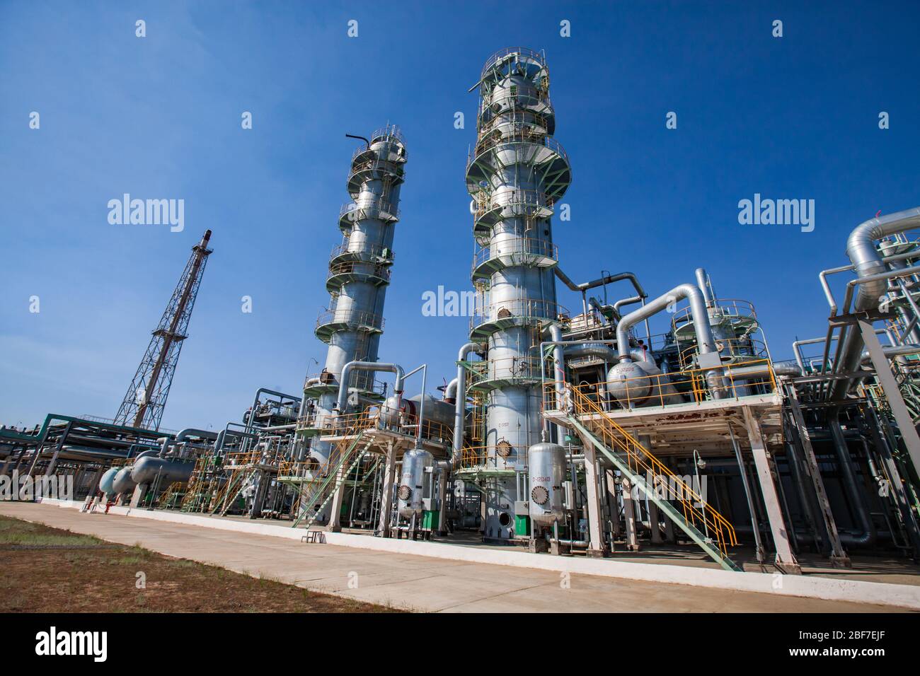 Panorama of petrochemical plant. Distillation towers, girder tower ...