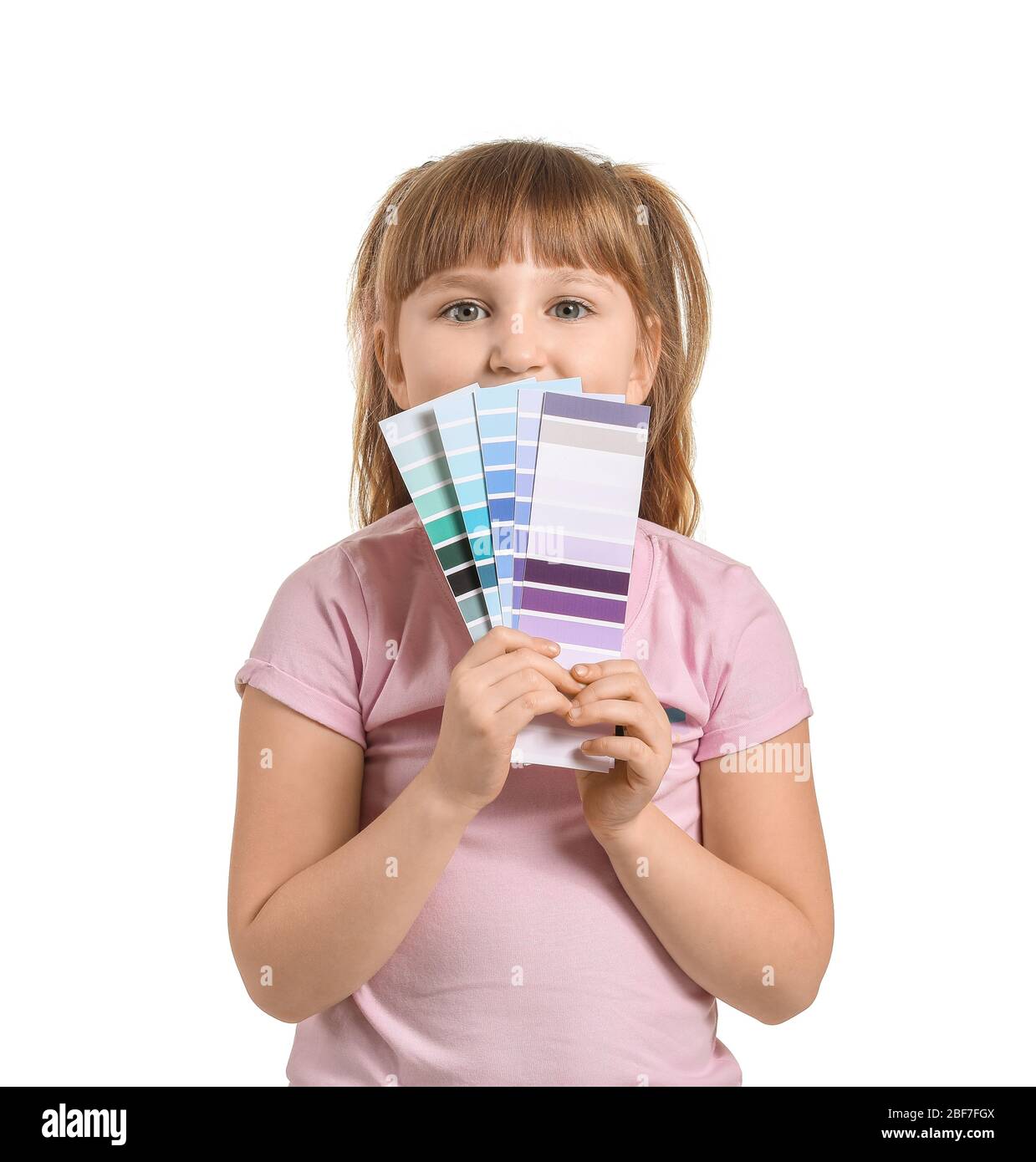Little girl with color palettes on white background Stock Photo - Alamy